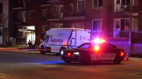 Police car and Garda World armored truck | Stock Video | Pond5