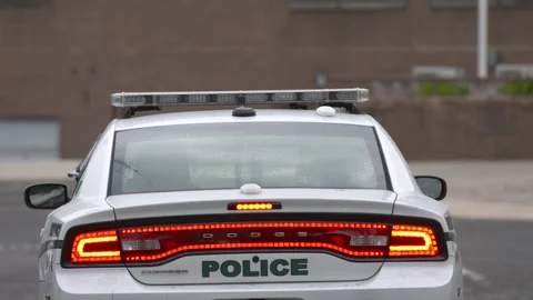 Police Car Leaving Station from Behind R... | Stock Video | Pond5