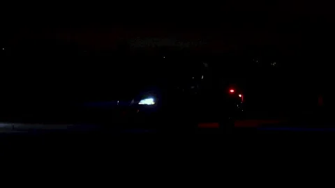 Police Car in the middle of the road at ... | Stock Video | Pond5