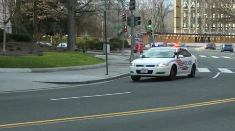 Police car responding fast, siren,on cur... | Stock Video | Pond5