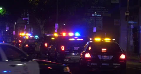 police cars responding with lights on | Stock Video | Pond5