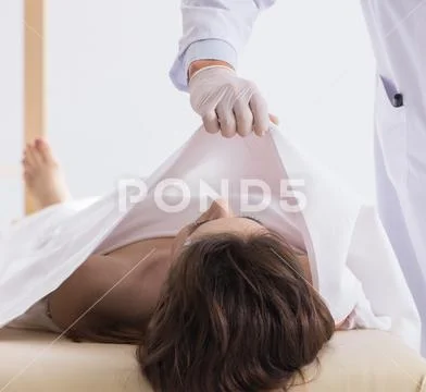 Police coroner examining dead body corpse in morgue Stock Image #112360501