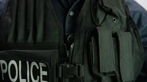 Police covering up body camera | Stock Video | Pond5
