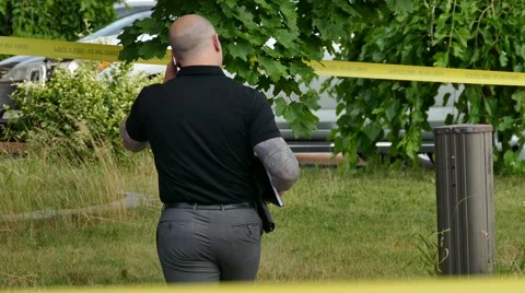 Police Detective Talking On The Phone At... | Stock Video | Pond5