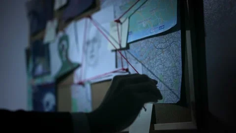 Police Detective Ties Together Clues On ... | Stock Video | Pond5