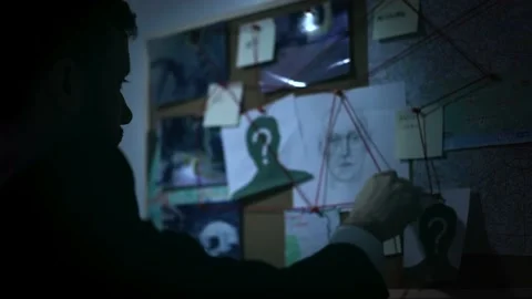 Police Detective Ties Together Clues On ... | Stock Video | Pond5