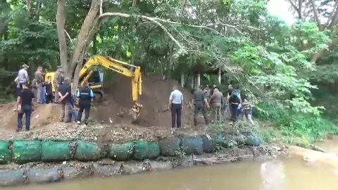 Police dig garden of missing British man... | Stock Video | Pond5