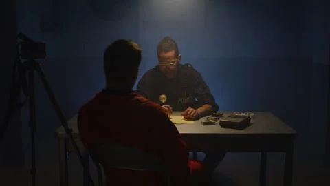 Police interrogation scene black cop whi... | Stock Video | Pond5