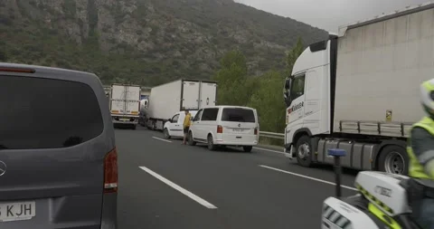 Police motorbike drive wrong way in traf... | Stock Video | Pond5