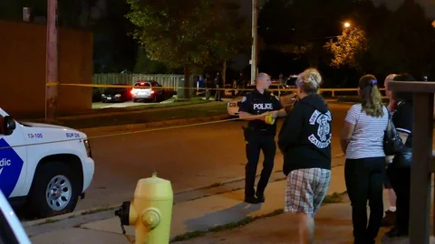 Police officer installing Yellow do not ... | Stock Video | Pond5