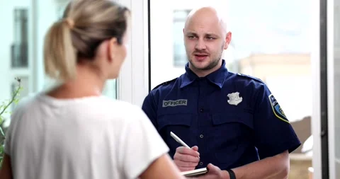 Police officer interrogating woman witne... | Stock Video | Pond5