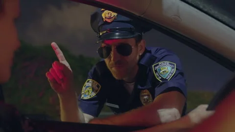 Police officer leans into car window, ho... | Stock Video | Pond5