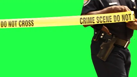 Police officer rolling out crime scene t... | Stock Video | Pond5
