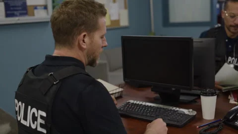 police officer team on desk duty working... | Stock Video | Pond5