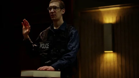 Police officer testifying in court on a ... | Stock Video | Pond5