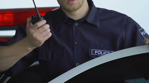Police officer in uniform calling for ba... | Stock Video | Pond5