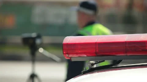 Police Officer Using Radar Speed Gun | Stock Video | Pond5