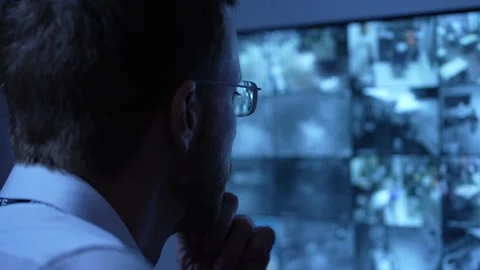 Police Officer Watching CCTV Video Scree... | Stock Video | Pond5