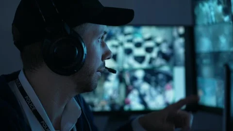 Police Officer Watching CCTV Video Scree... | Stock Video | Pond5