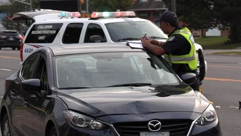 Police officers at accident scene on Tor... | Stock Video | Pond5
