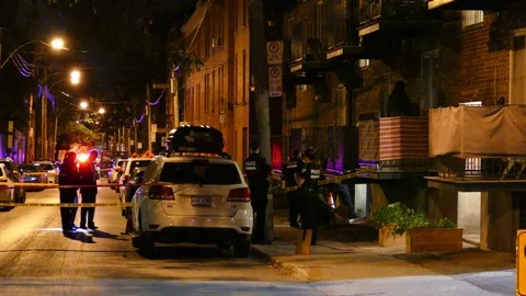 Police officers canvassing area of crime... | Stock Video | Pond5