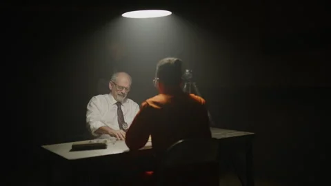 Police officers interviewing inmate witn... | Stock Video | Pond5