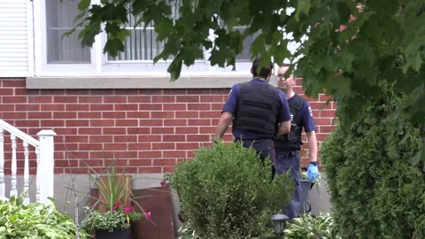 Police officers at investigate murder cr... | Stock Video | Pond5