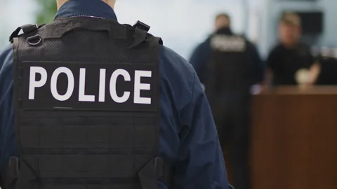 Police officers in a precinct solving ca... | Stock Video | Pond5