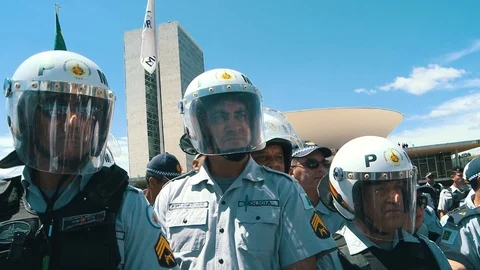 Police officers stand at the ready with ... | Stock Video | Pond5