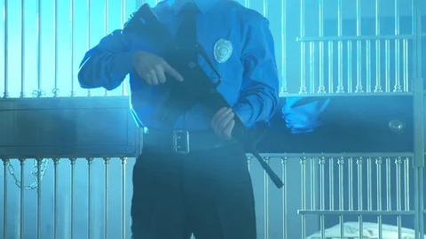 Police Security Guard - stands with mach... | Stock Video | Pond5