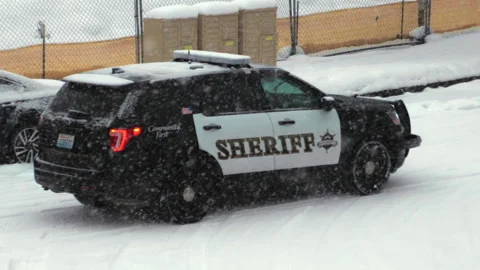 Police Sheriff SUV driving through snow ... | Stock Video | Pond5