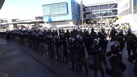 Police stand in line with riot shields a... | Stock Video | Pond5