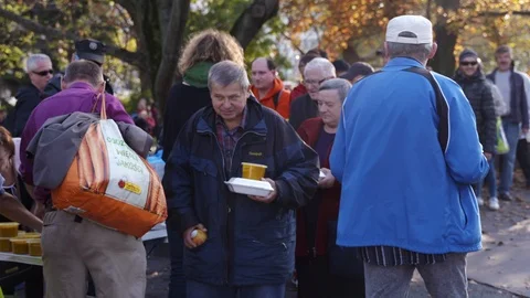 Polish destitute homeless people lined f... | Stock Video | Pond5