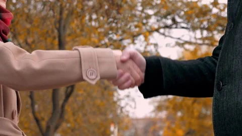 Polite handshake between man and woman a... | Stock Video | Pond5