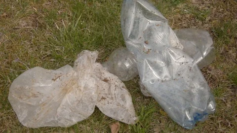 Pollution of plastics on the ground. Pla... | Stock Video | Pond5