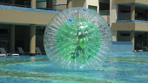 Pool Human Hamster Ball Playing - Closeu... | Stock Video | Pond5