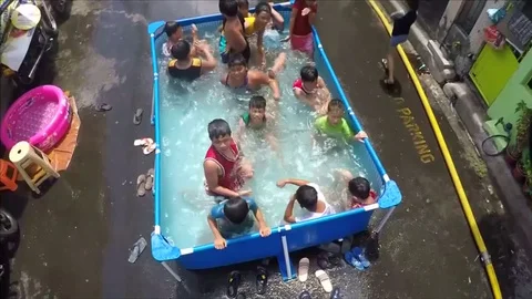 Pool party in the streets of Manila help... | Stock Video | Pond5