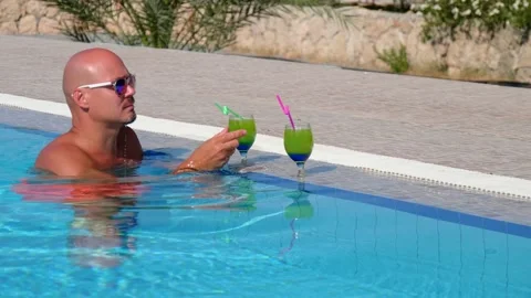 Pool party. young bald modern caucasian ... | Stock Video | Pond5