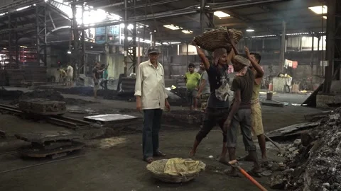 Poor Indian labors working at factory wi... | Stock Video | Pond5