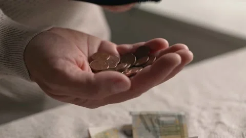 A poor man counting coins in the palm of... | Stock Video | Pond5