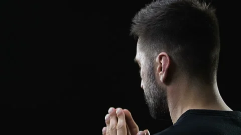 Poor man praying to Jesus Christ against... | Stock Video | Pond5