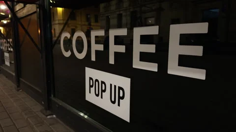 Pop up sign on coffee shop building faca... | Stock Video | Pond5