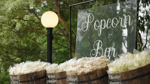 Popcorn bar. Wooden barrels full of popc... | Stock Video | Pond5