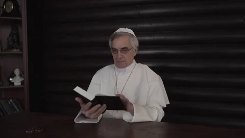 Pope reads the Bible in his office | Stock Video | Pond5