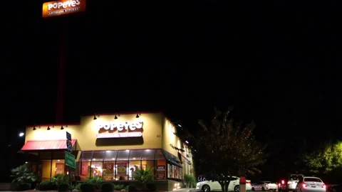 Popeyes fast food restaurant at night lo... | Stock Video | Pond5