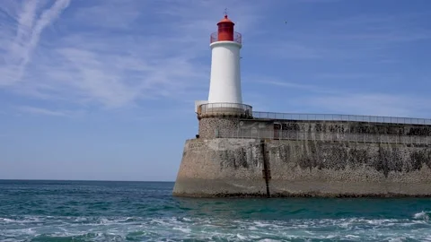 Port lighthouse at the town entrance of ... | Stock Video | Pond5
