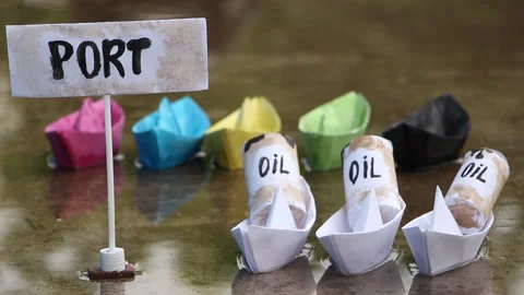 Port. Paper ships with oil barrels | Stock Video | Pond5