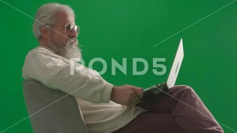 Photograph: Portrait of aged bearded man on chroma key green screen ...
