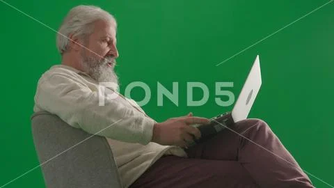 Portrait of aged bearded man on chroma key green screen background ...