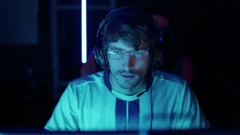 Portrait of a angry gamer in headphones,... | Stock Video | Pond5